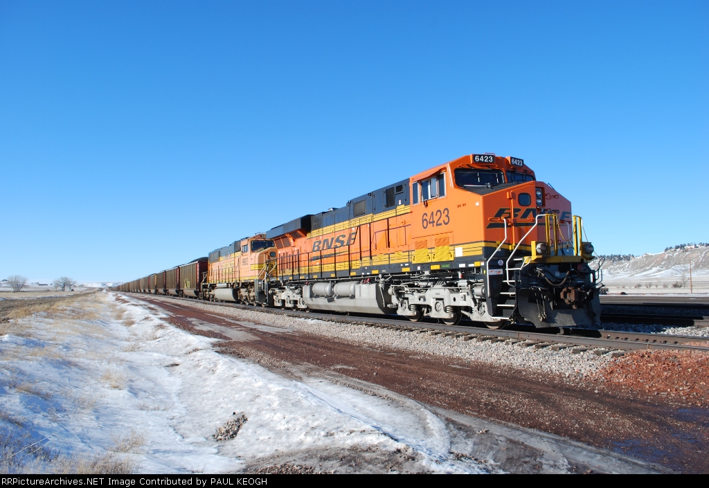 BNSF 6423 waits to roll eastbound with a loaded coal train.